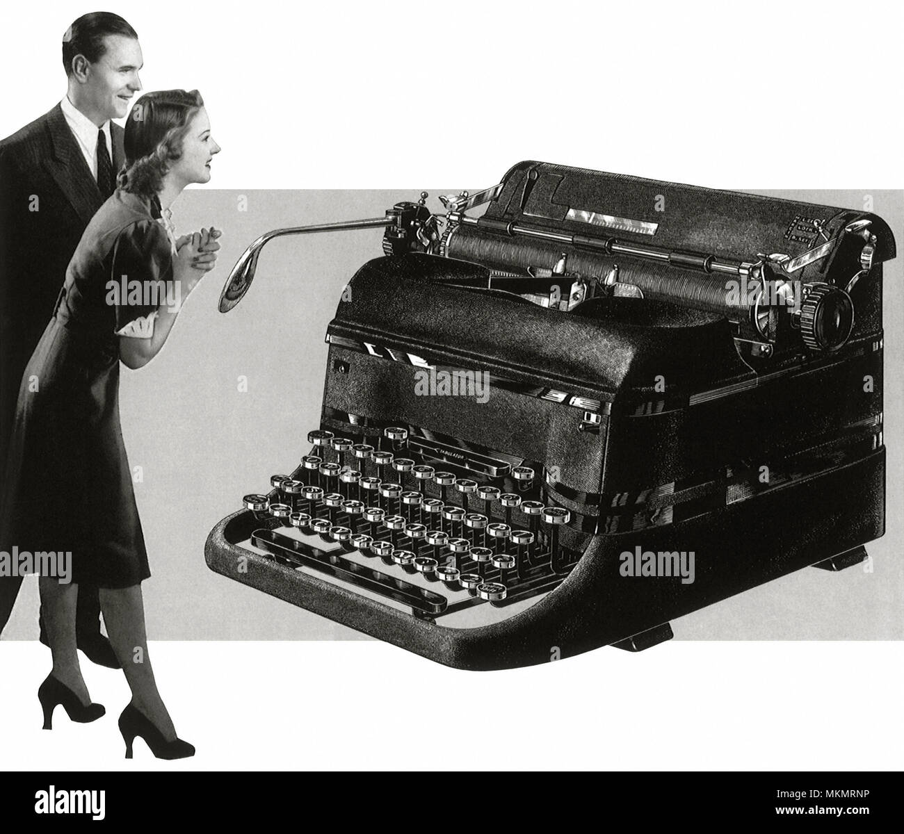 Pair Happy with Typewriter Stock Photo - Alamy