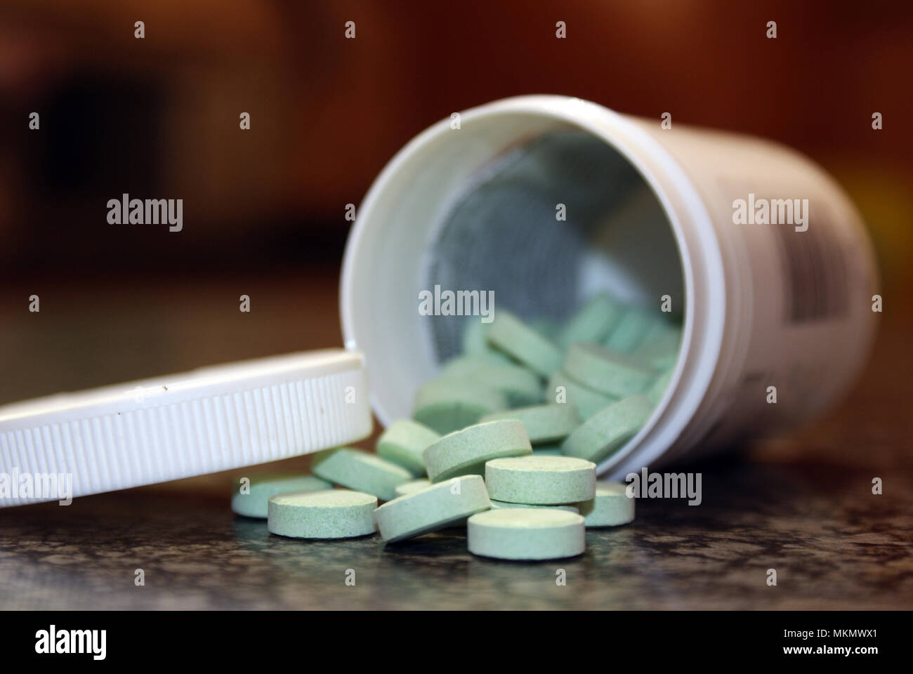 spilled tablets on table Stock Photo - Alamy