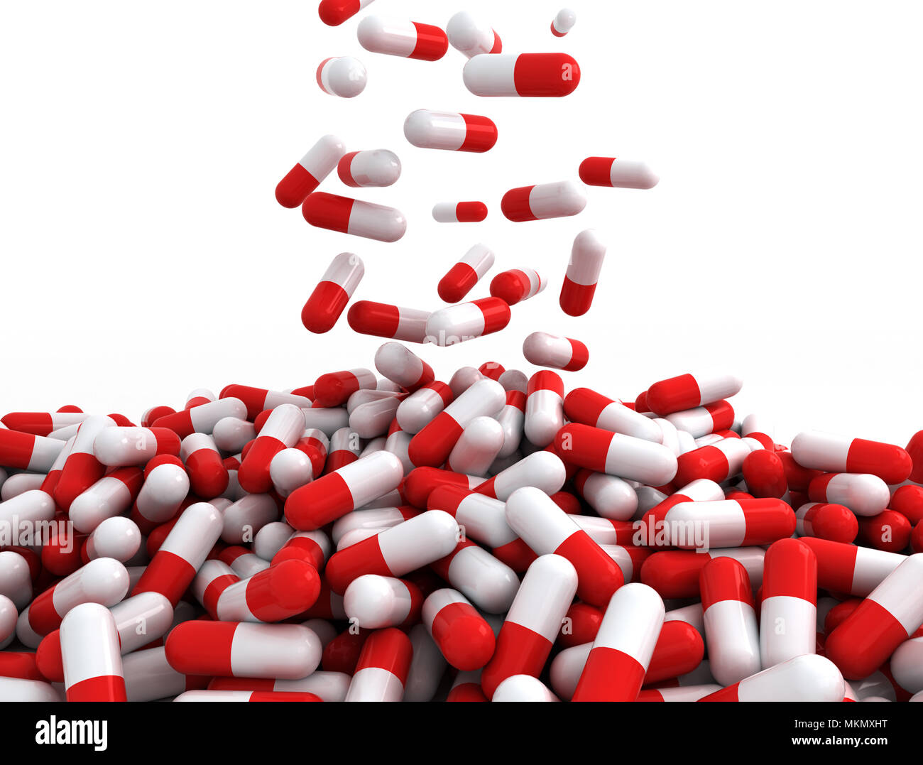Falling red capsules on white background Stock Photo - Alamy
