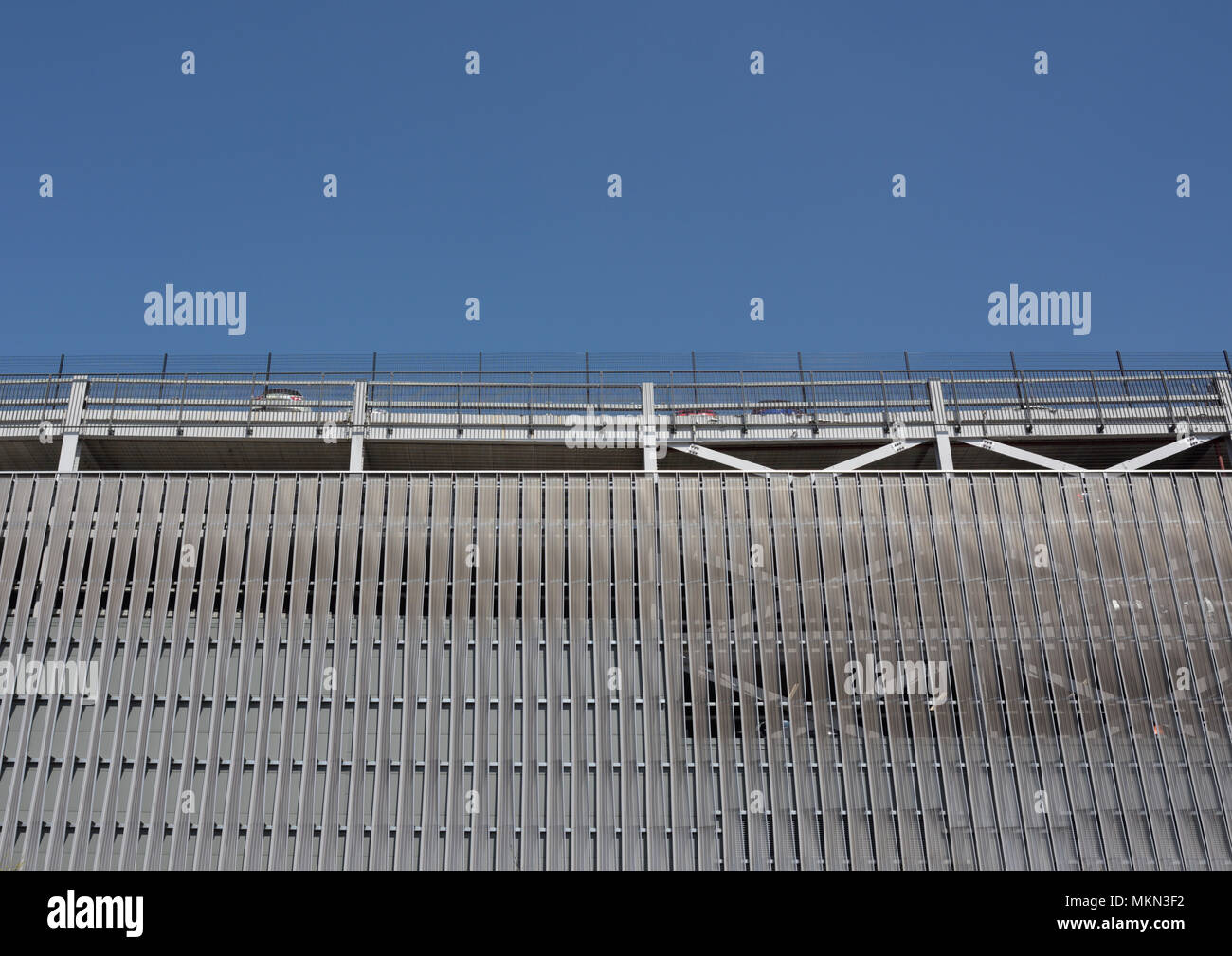 Multi storey car park facade with metal cladding, low angle view in ...