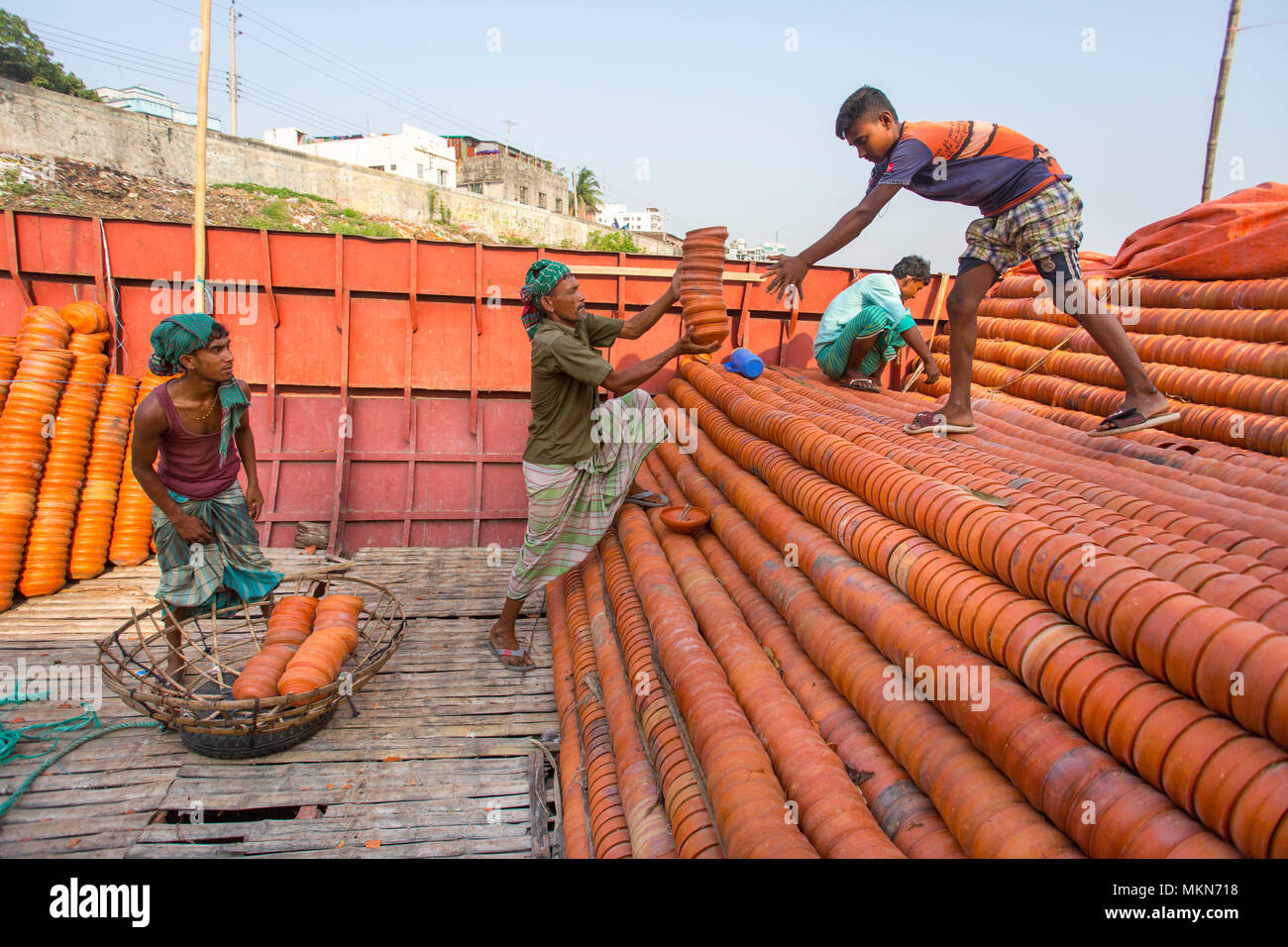 Pottery load unload on transporting boat at Burigonga River near ...