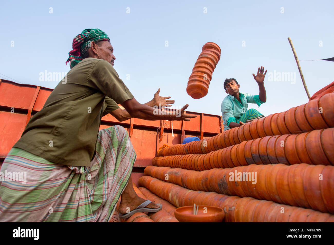 Pottery load unload on transporting boat at Burigonga River near ...