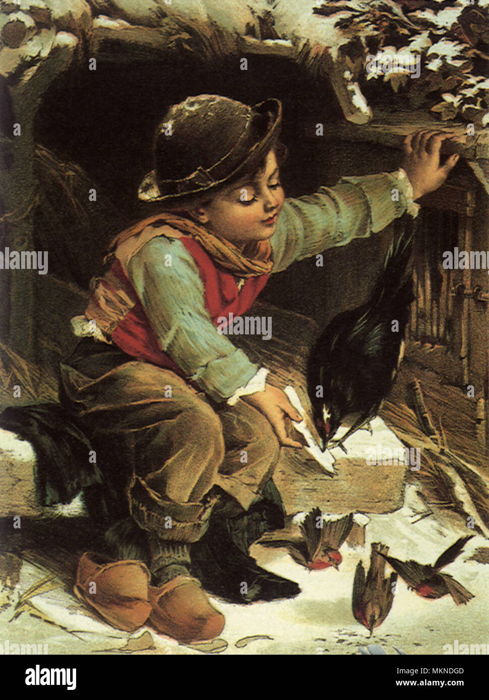 Young Boy with Birds in Snow Stock Photo - Alamy