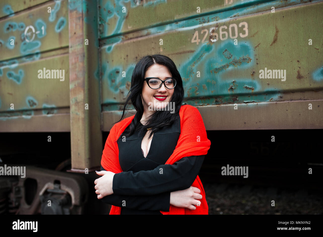 Brunette girl wear in black with glasses in railway station Stock Photo ...