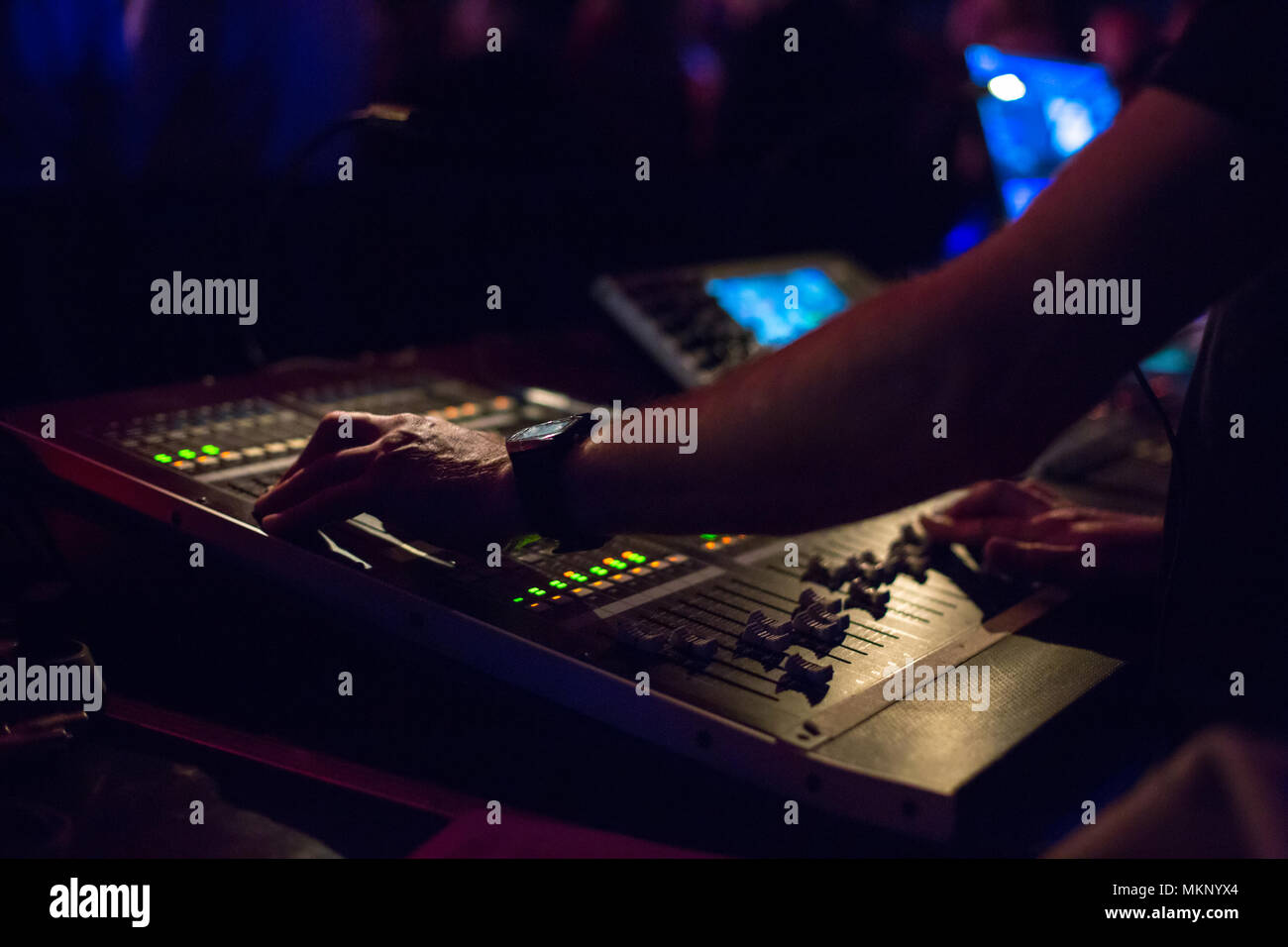 Soundman working on mixing console hi-res stock photography and images ...