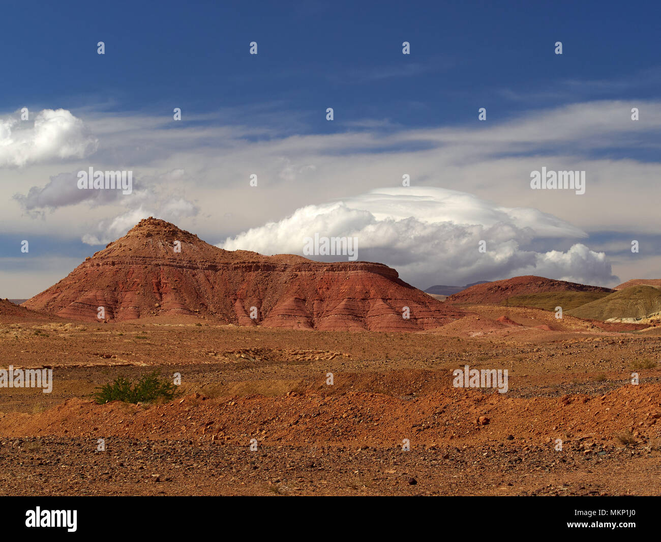 Bright orange mountains Middle Atlas against a blue sky background with ...