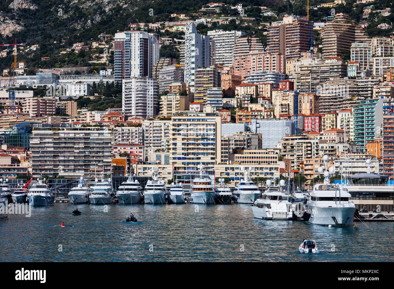 Monaco principality, city center cityscape from the sea port, densely ...