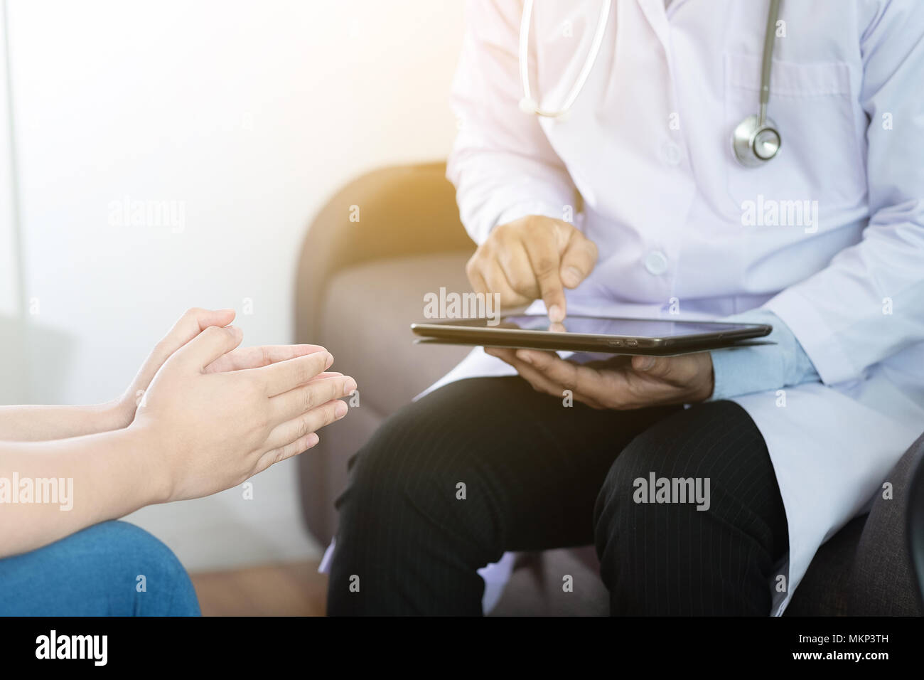 Medicine and health care concept Doctor and patient discussing ...
