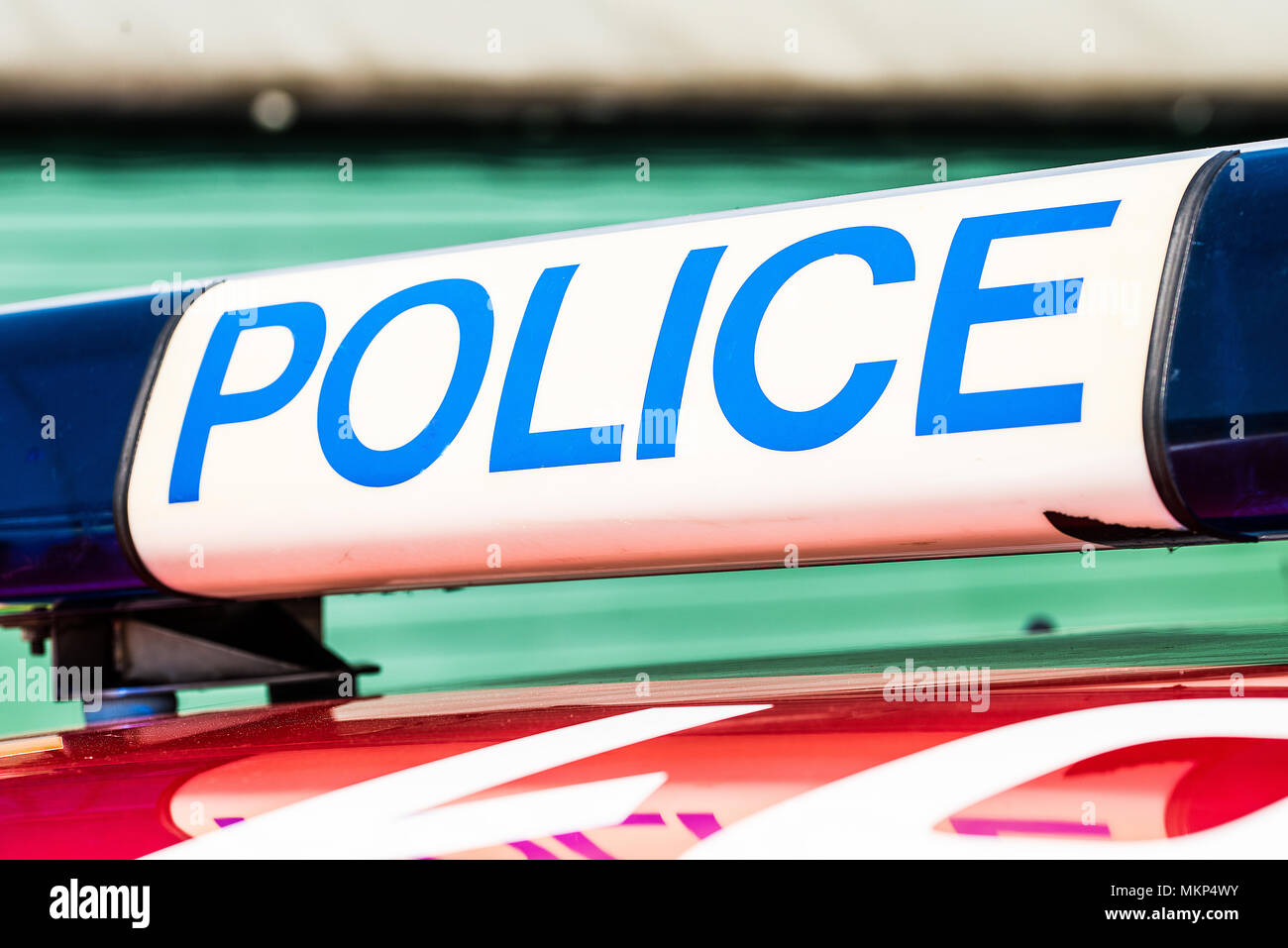 Police sign with blue lights on top of a patrol vehicle Stock Photo - Alamy