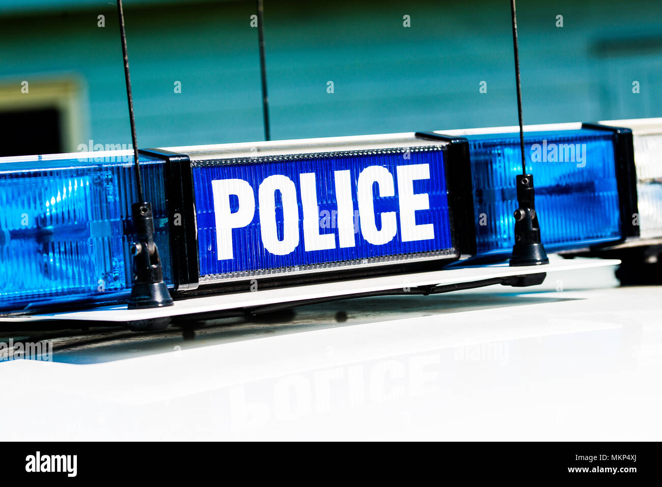 Police sign with blue lights on top of a patrol vehicle Stock Photo - Alamy