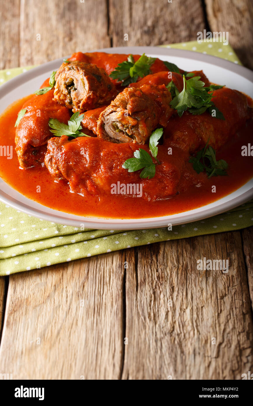 Italian beef steak braciole stuffed with parsley and cheese in tomato ...