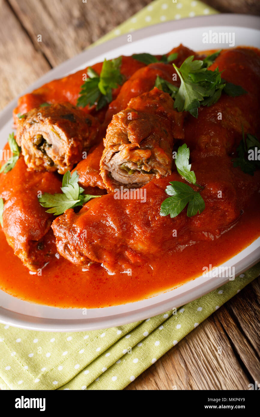 Italian meat roll braciole stuffed with parsley and cheese in tomato ...