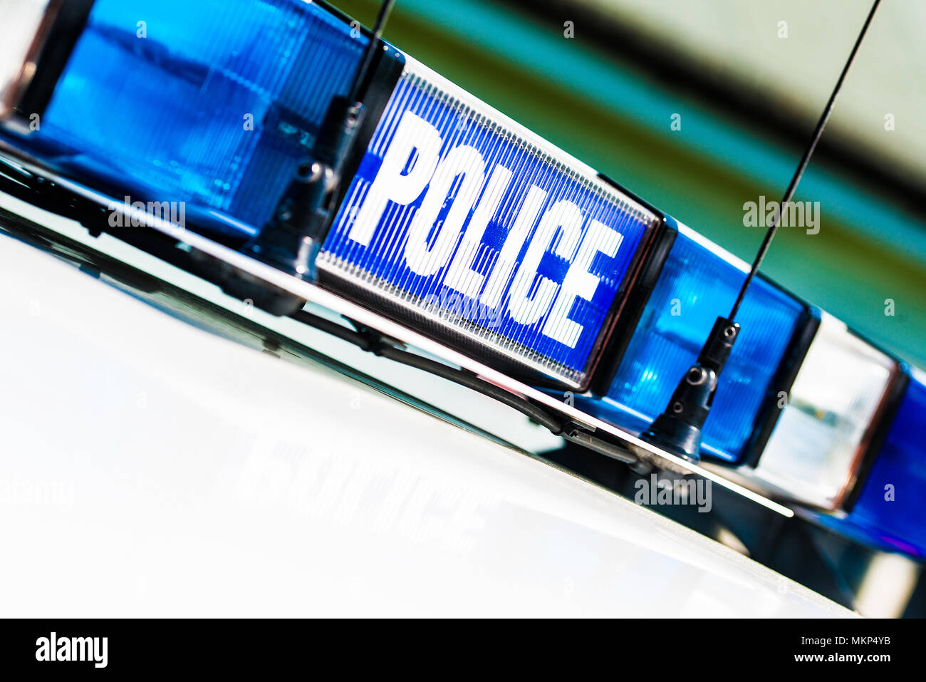 Police sign with blue lights on top of a patrol vehicle Stock Photo - Alamy