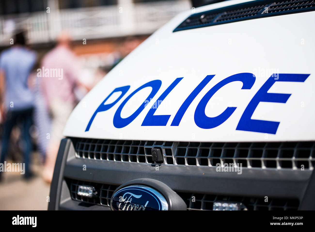 Large police sign on the front of a white patrol van Stock Photo - Alamy