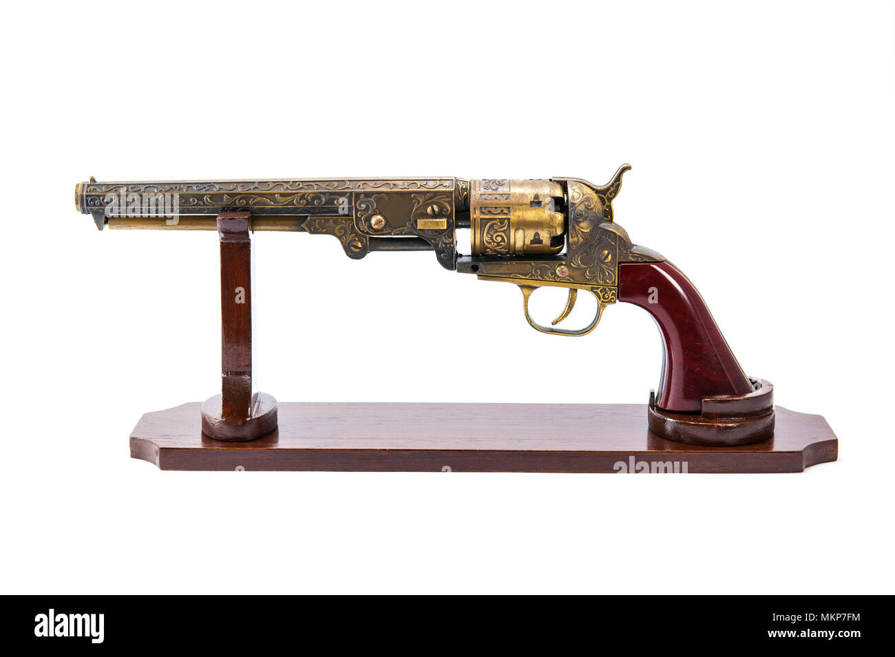 Antique brass gun with wooden stand on white background Stock Photo - Alamy