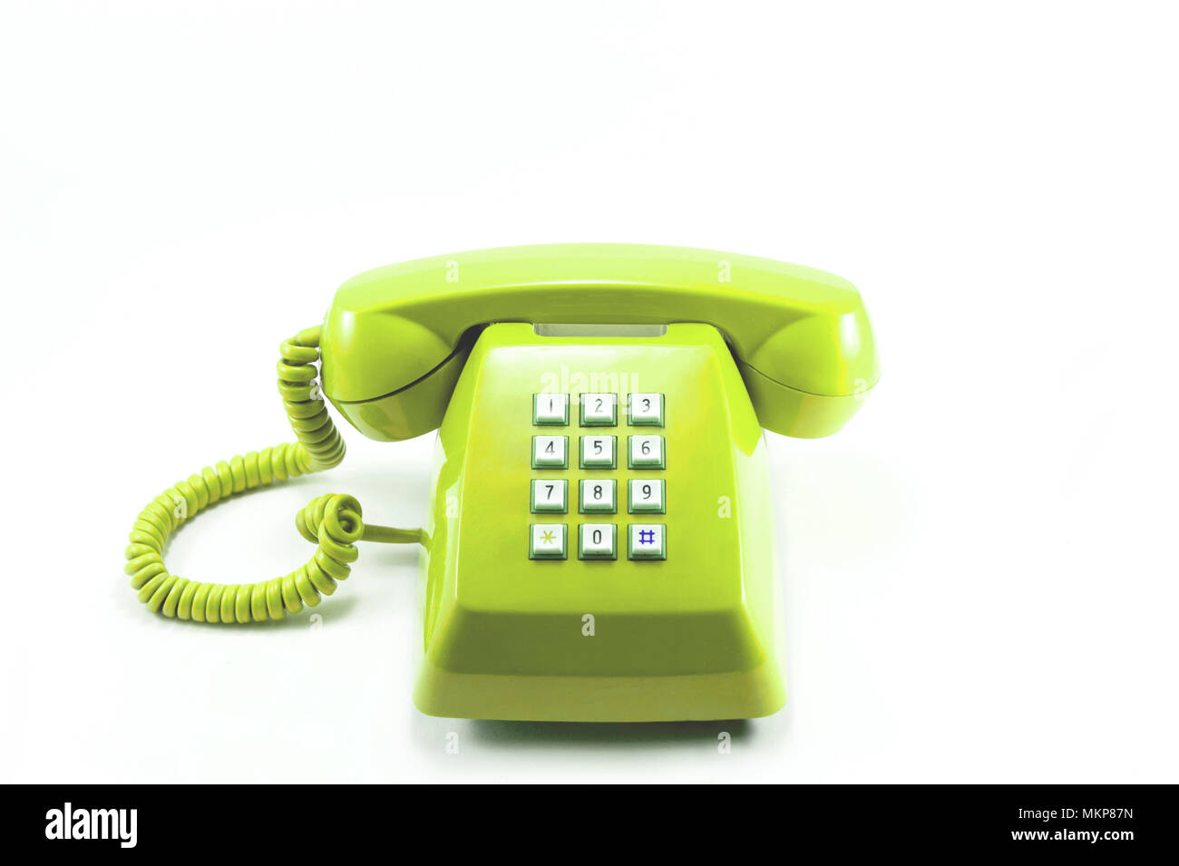 Bright green vintage telephone on white background Stock Photo - Alamy