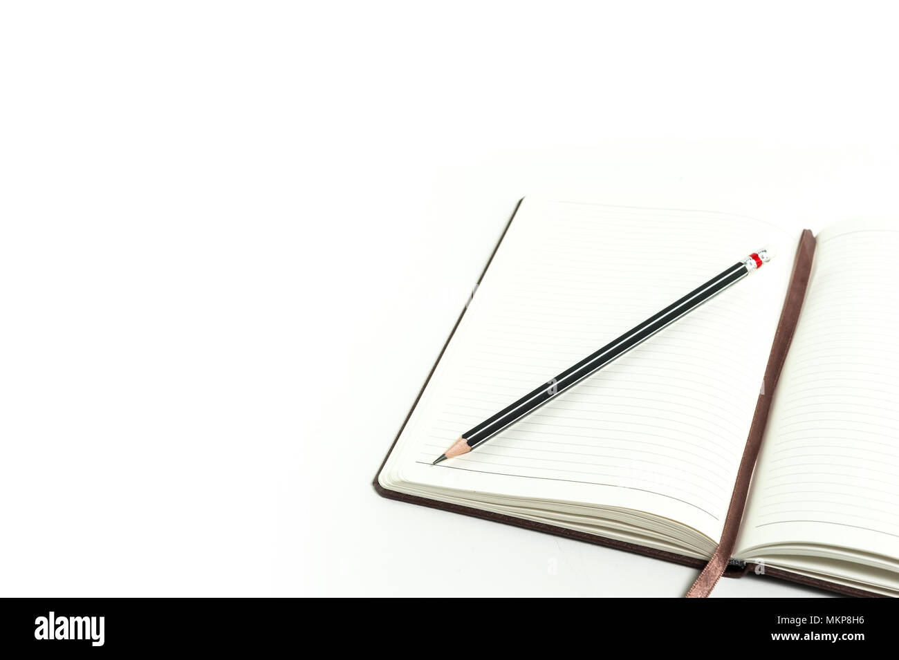 Open notebook diary with pencil on white background. Top view Stock ...