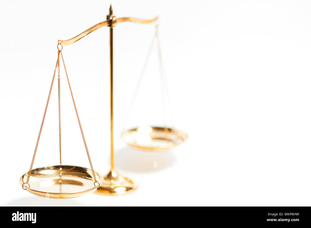 Close up of gold brass balance scale, Sign of justice isolated on white ...