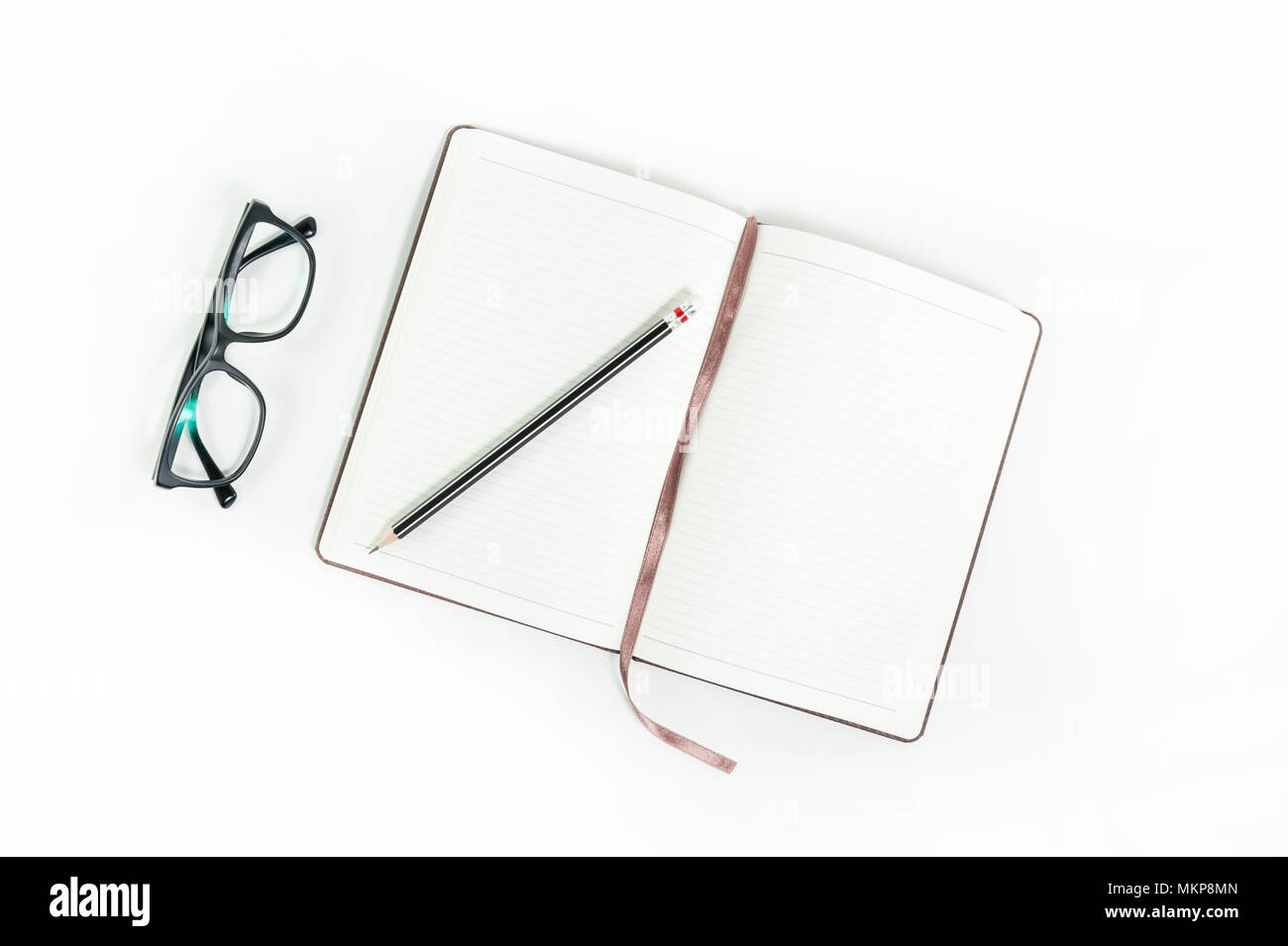 Open journal overhead on white hi-res stock photography and images - Alamy