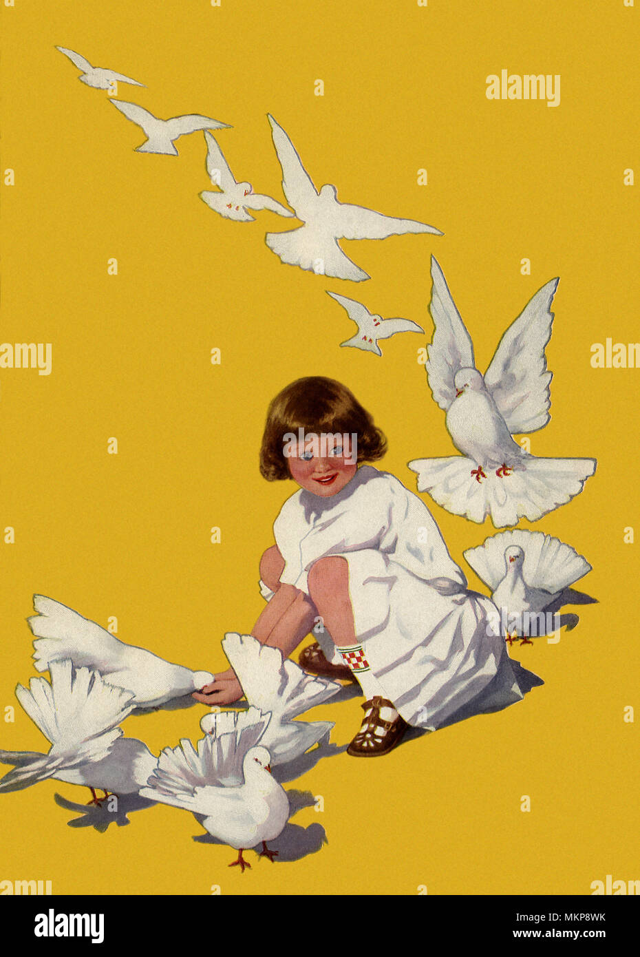 Girl feeding Doves Stock Photo - Alamy