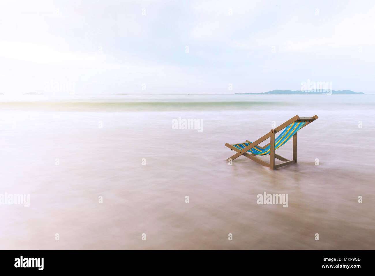 Long exposure of beach chairs on the white sand beach background Stock ...
