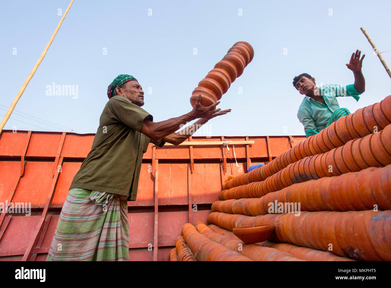 Pottery load unload on transporting boat at Burigonga River near ...
