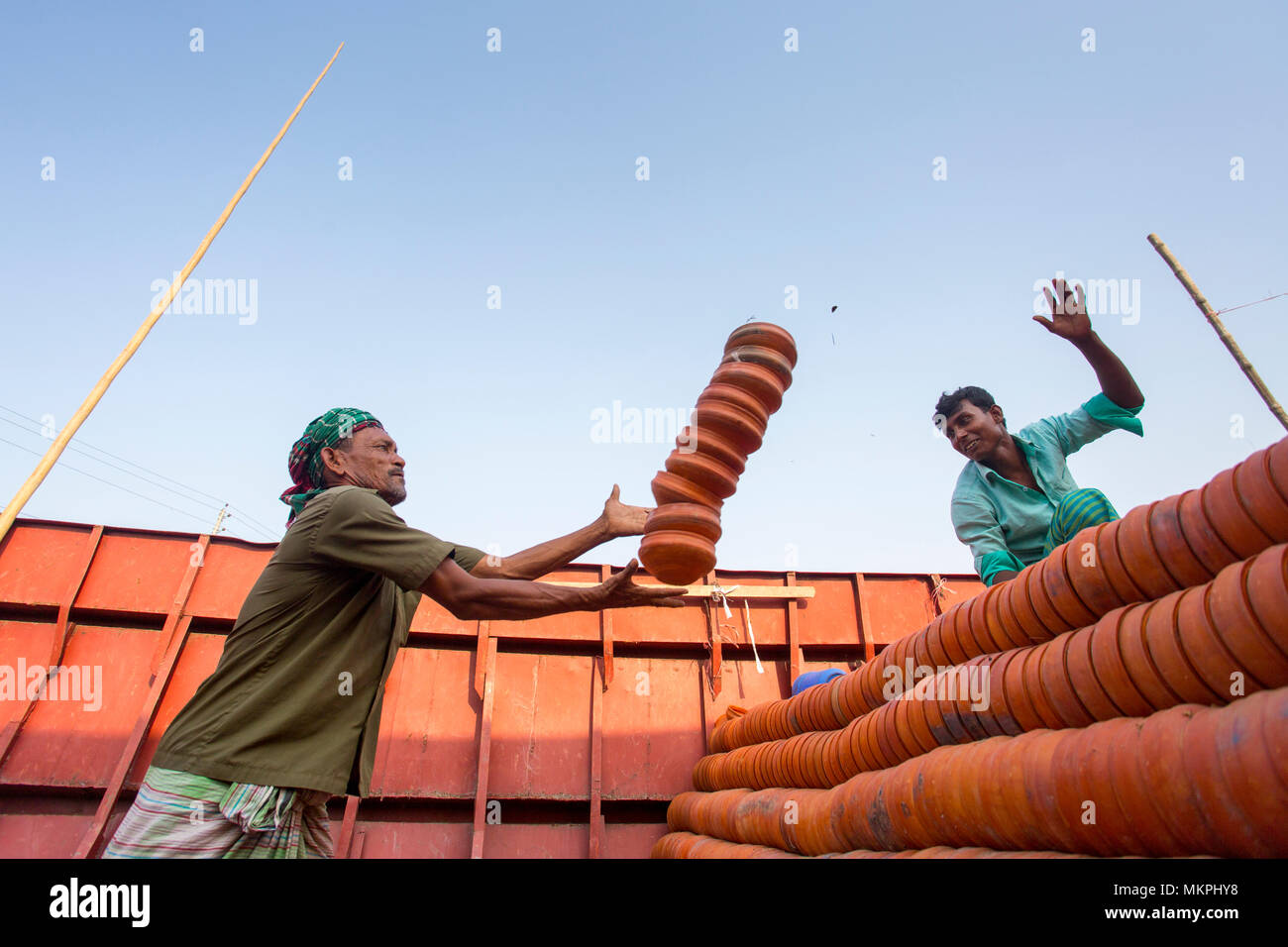 Pottery load unload on transporting boat at Burigonga River near ...