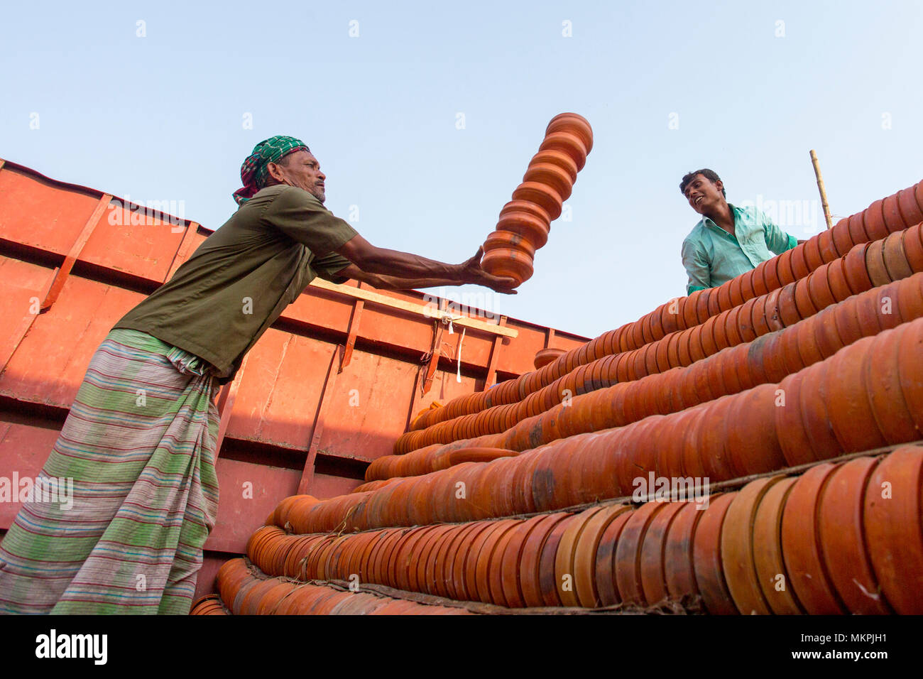 Pottery load unload on transporting boat at Burigonga River near ...