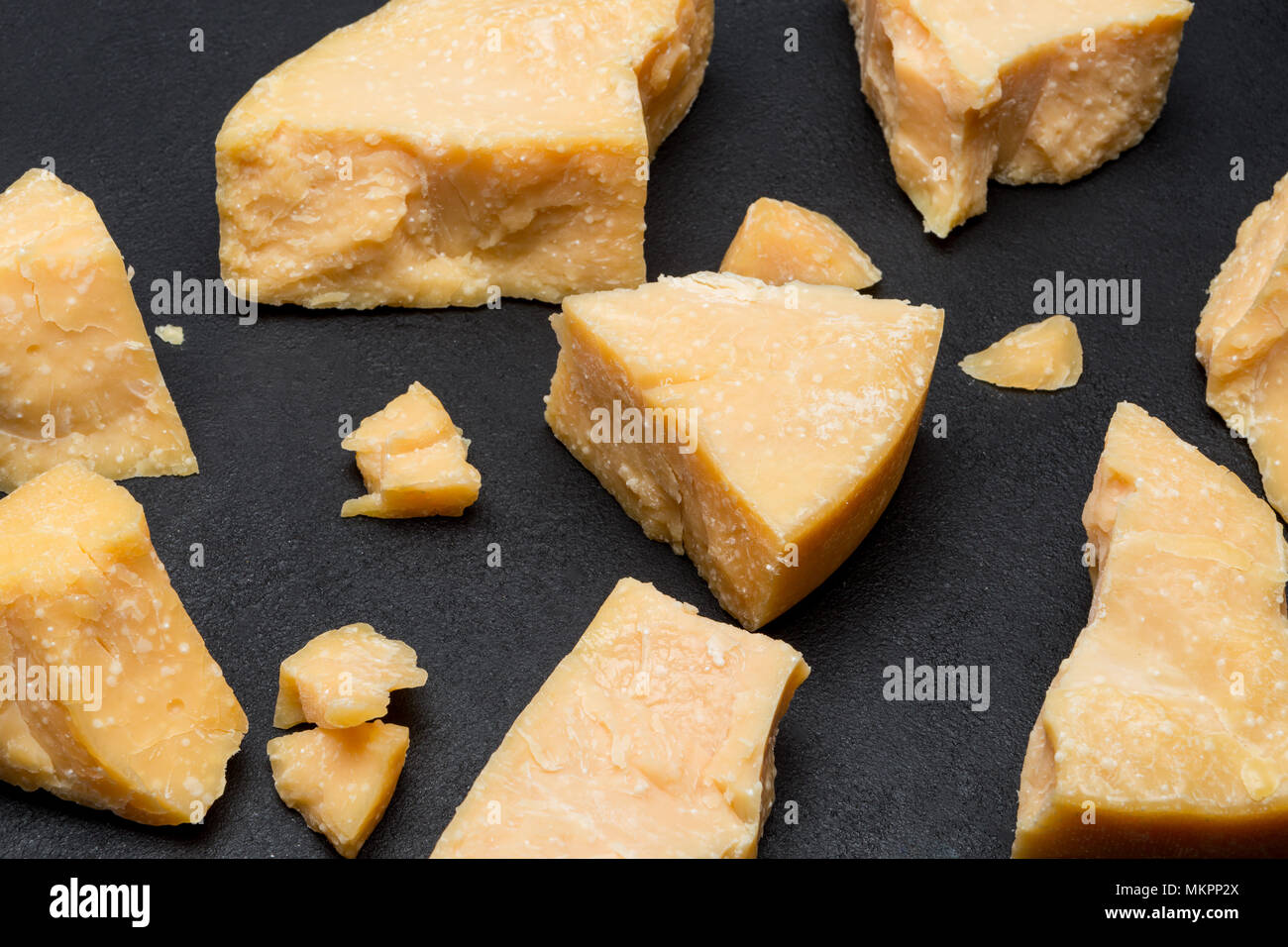 pieces of parmesan or parmigiano cheese Stock Photo - Alamy