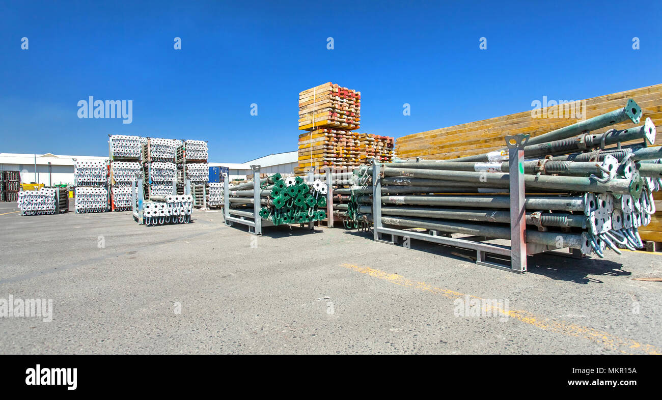 Scaffolding poles and brackets stacked in a yard Stock Photo - Alamy