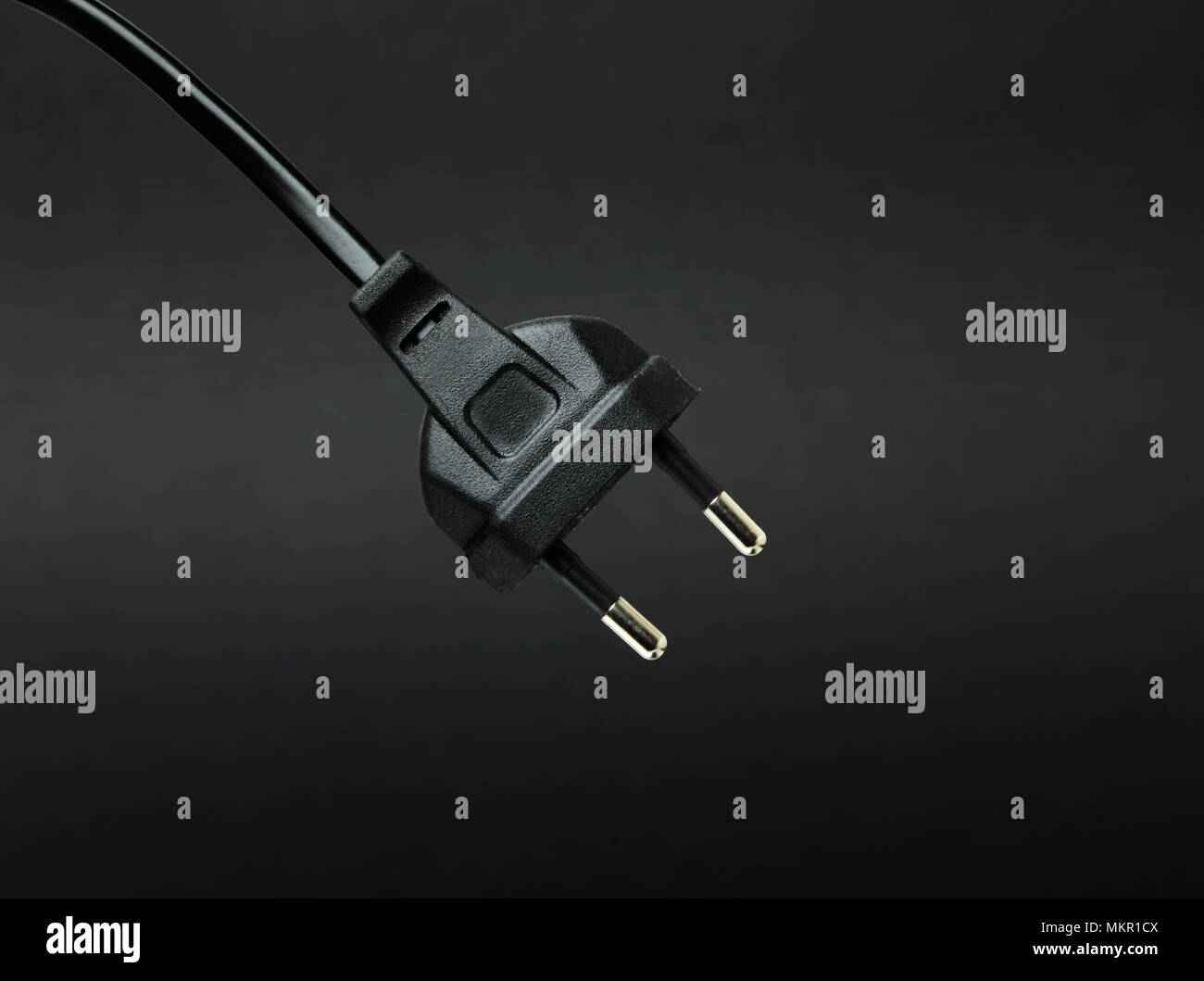 Two-pole plug for electrical equipment in Europe, isolated against a ...