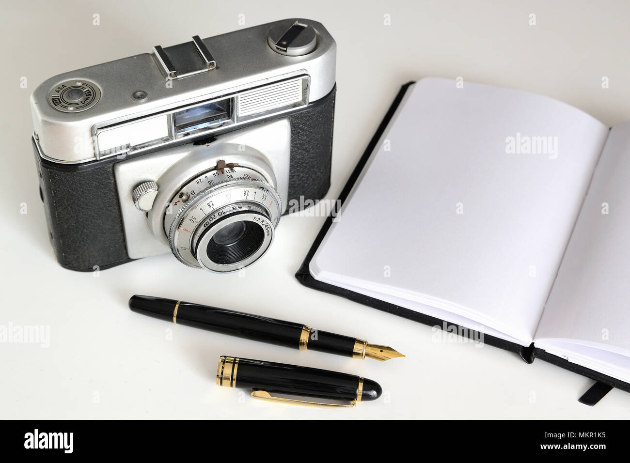 Vintage camera, pen and notebook for the nostalgic journalist and ...