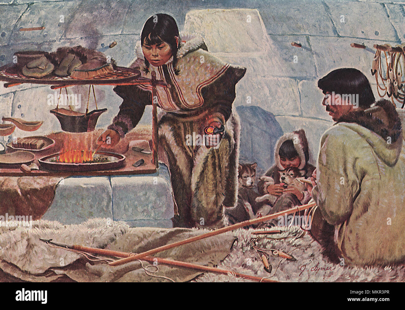 Eskimo Family cooks Food in Igloo Stock Photo - Alamy