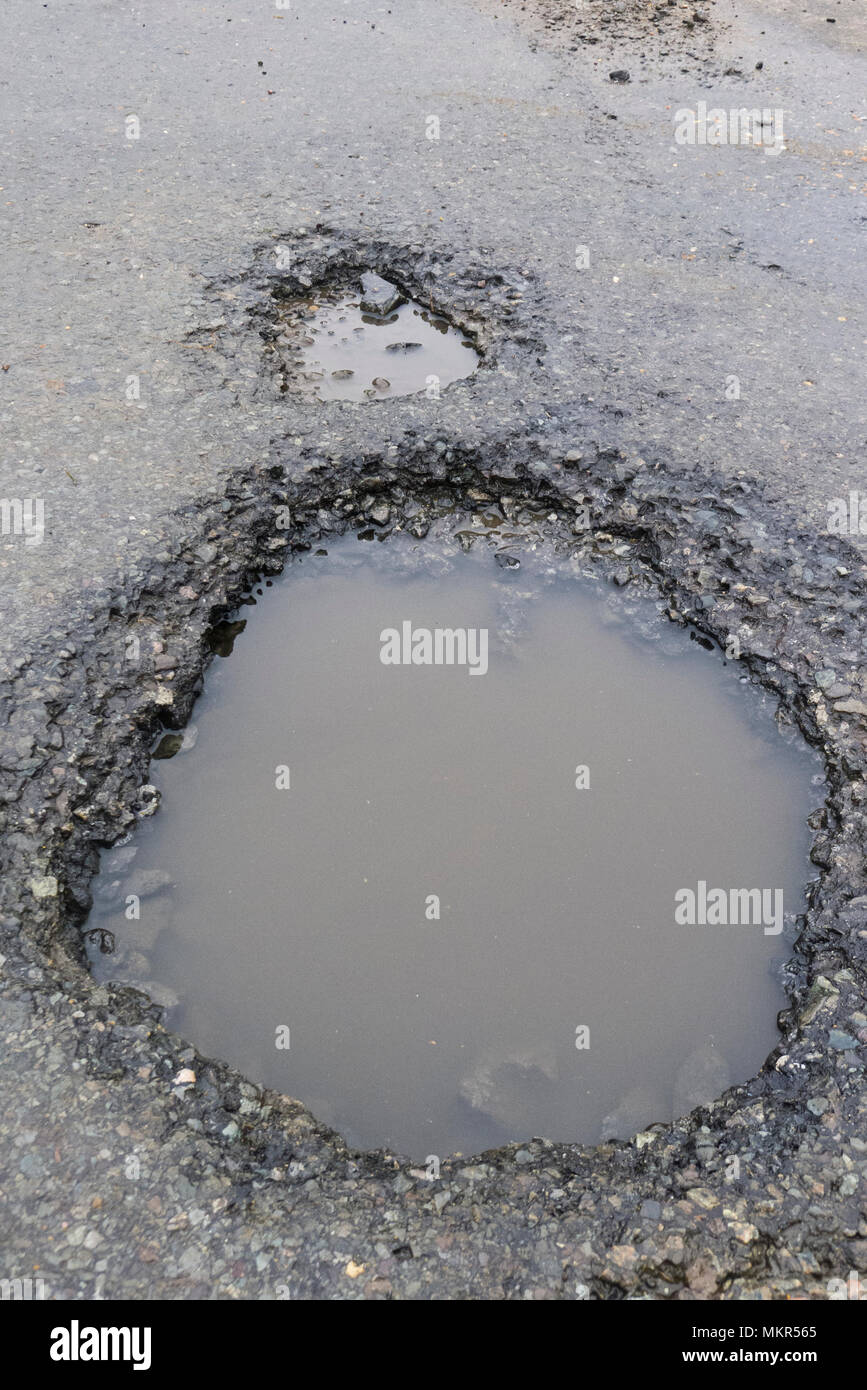 Potholes road and puddle hi-res stock photography and images - Alamy