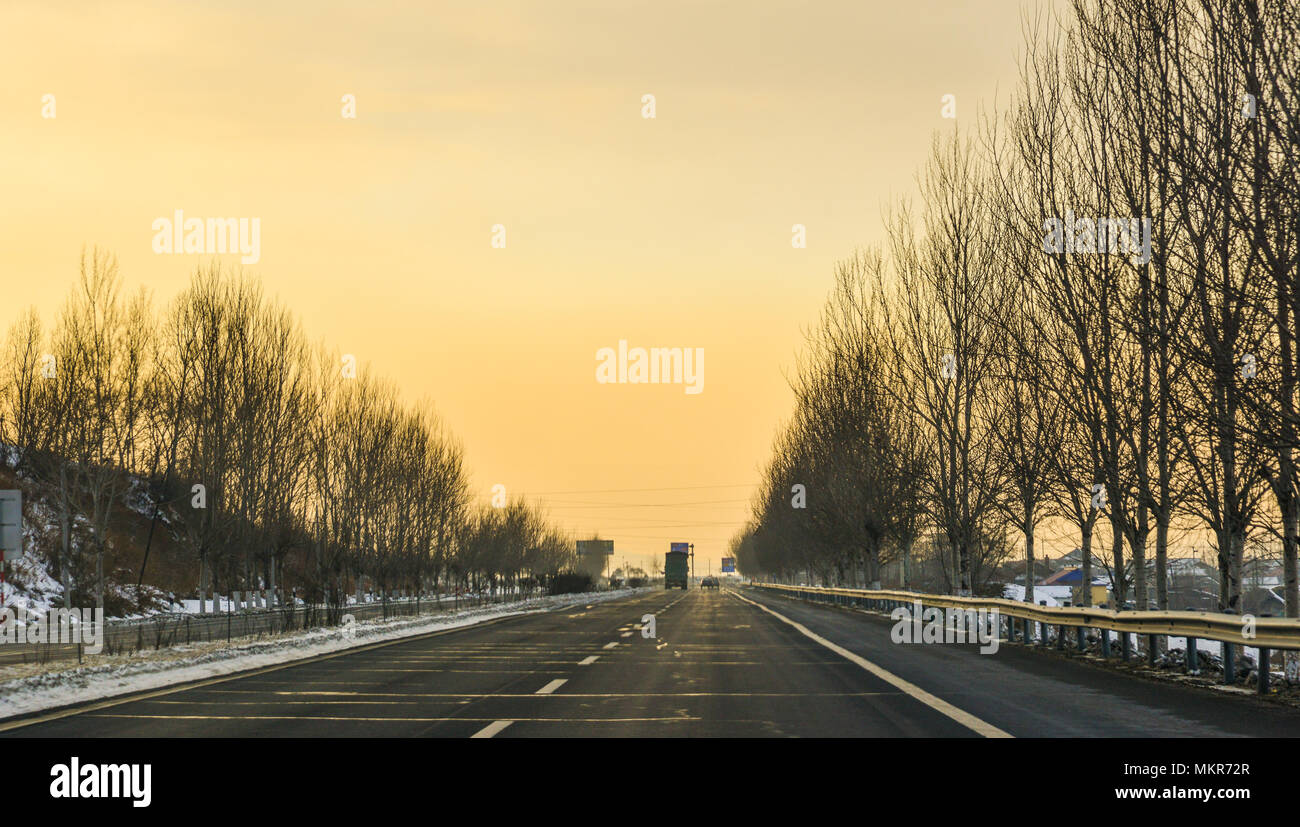 Harbin, China - Feb 25, 2018. Sunset on highway in Harbin, China ...