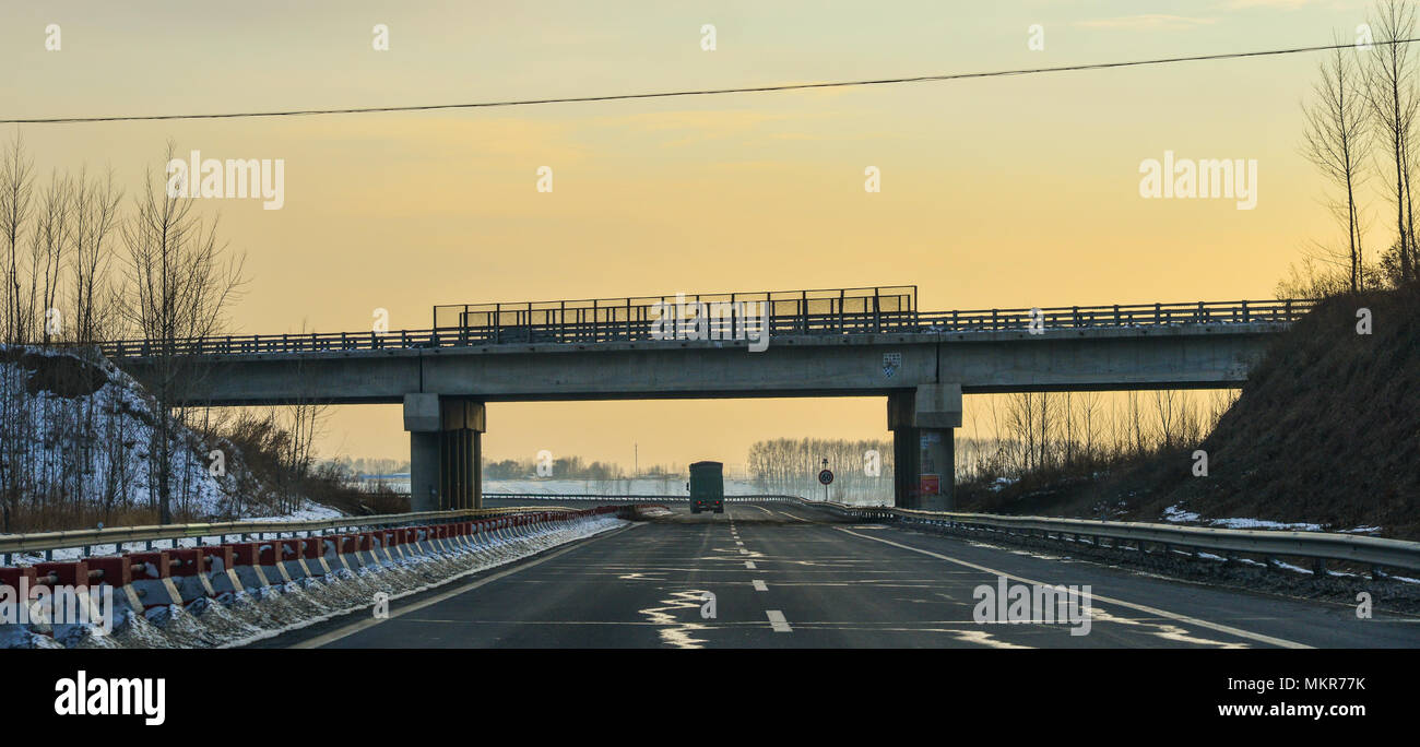 Harbin, China - Feb 25, 2018. Sunset on highway in Harbin, China ...
