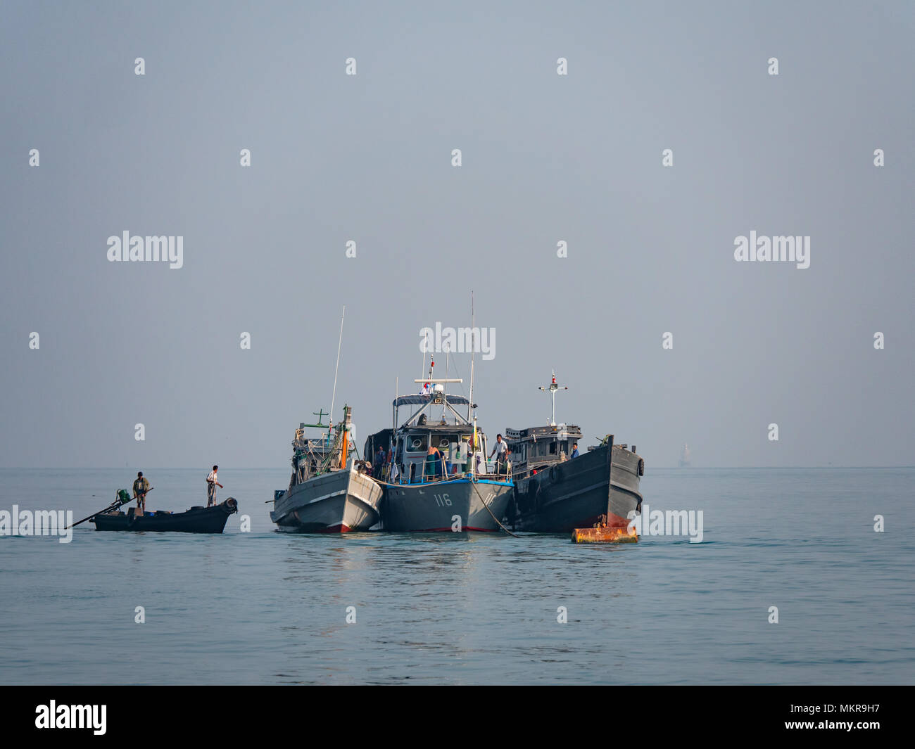 Three coast guard vessels moored off Myeik, formerly Mergui, the ...