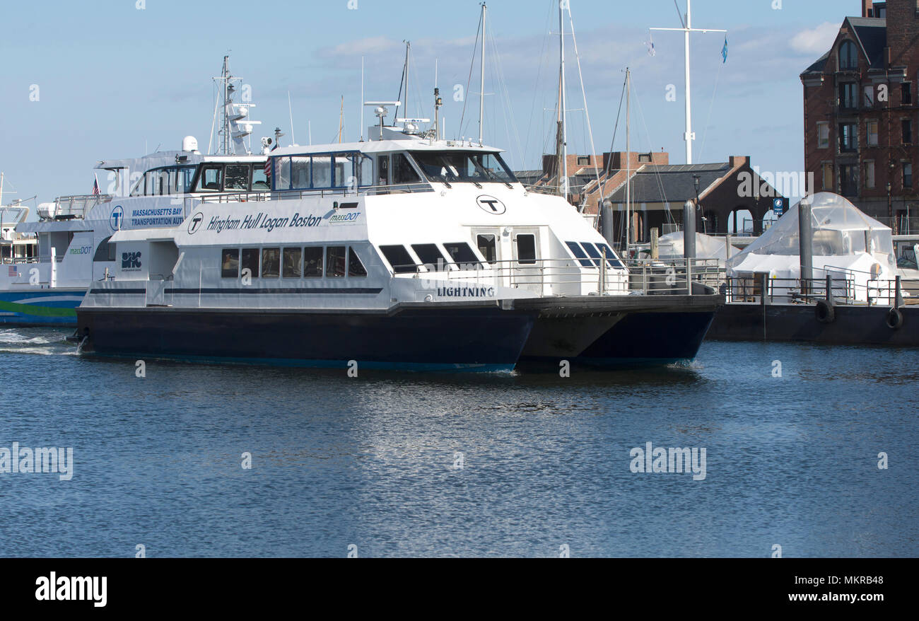 A commuter boat arrives in Boston Harbor to pick up afternoon commuters ...