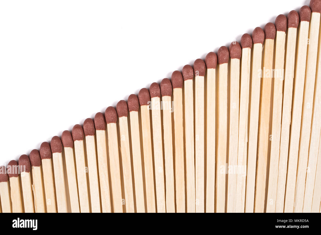 Matches in a row on white background Stock Photo - Alamy