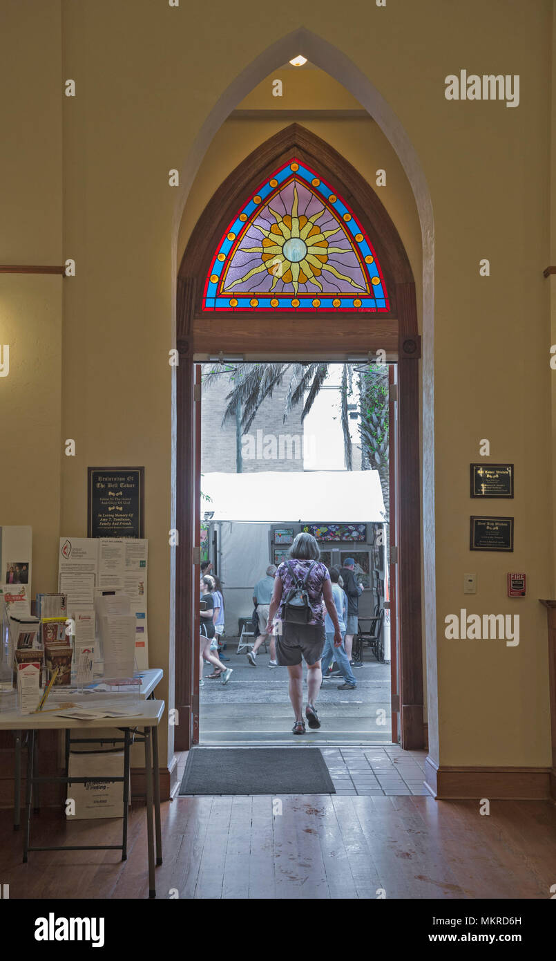 Woman walking through door hi-res stock photography and images - Alamy