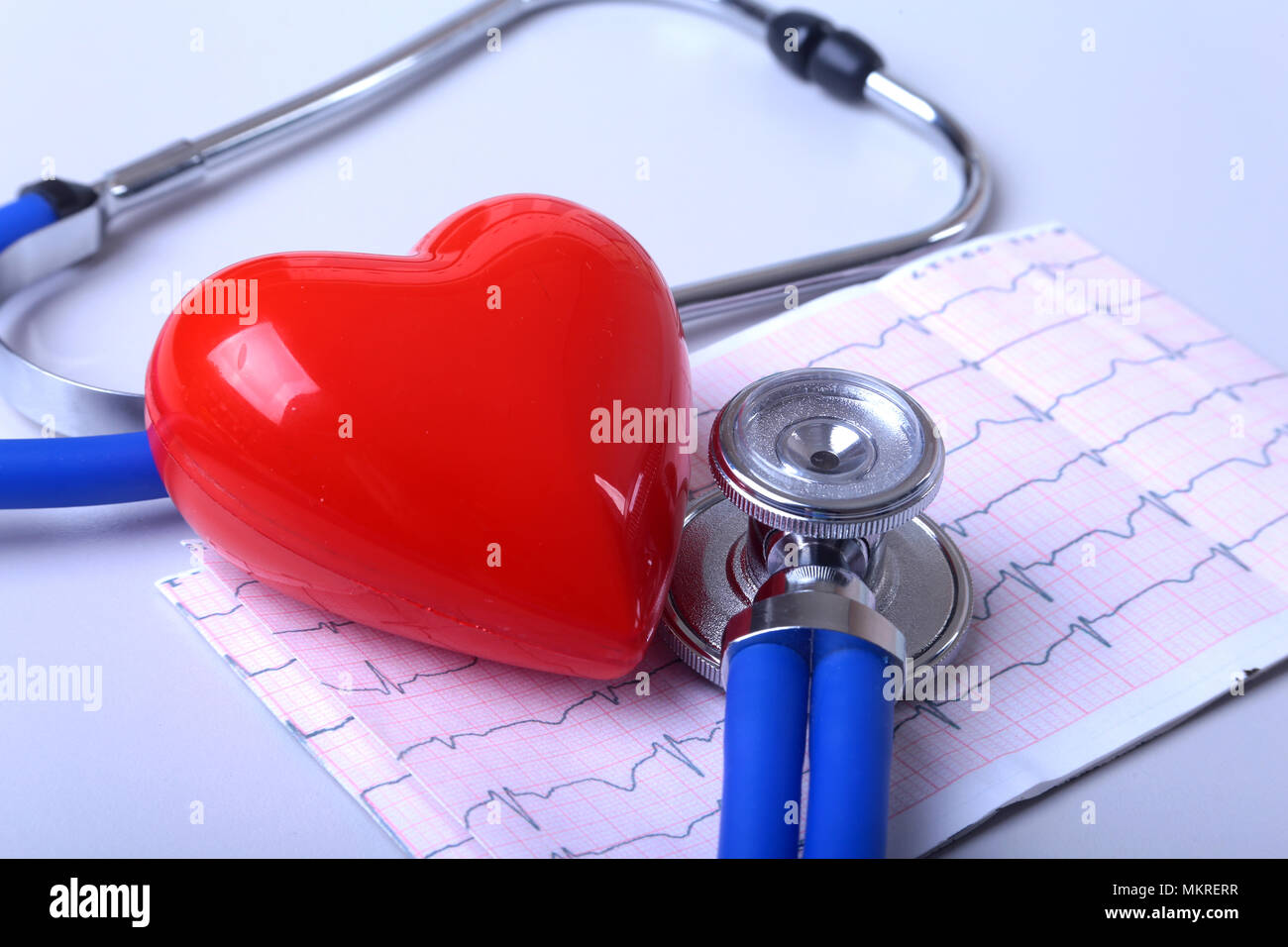 Heart with medical stethoscope on the paper cardiogram Stock Photo - Alamy