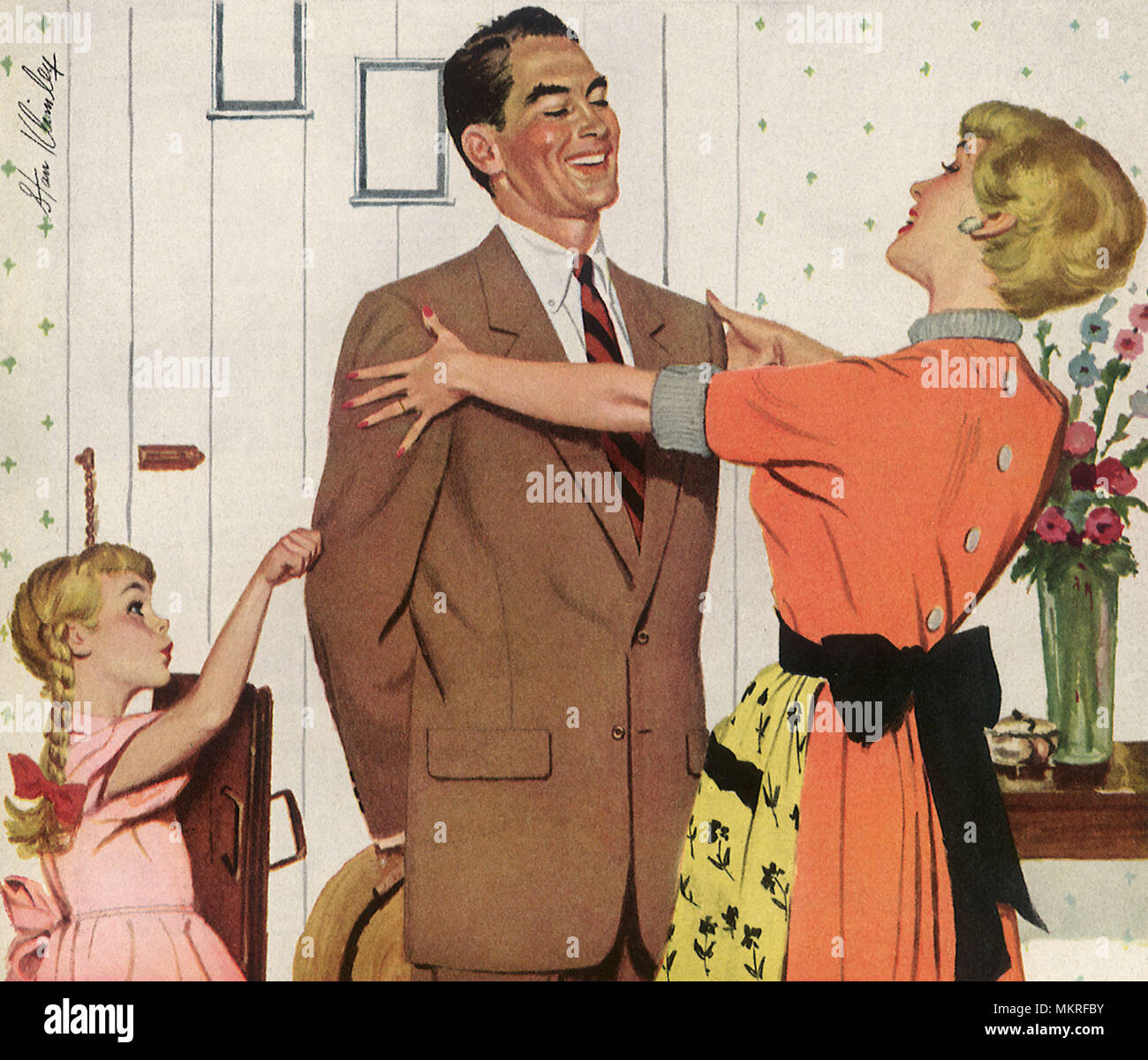 Mother and Daughter admire Father's new Suit Stock Photo - Alamy