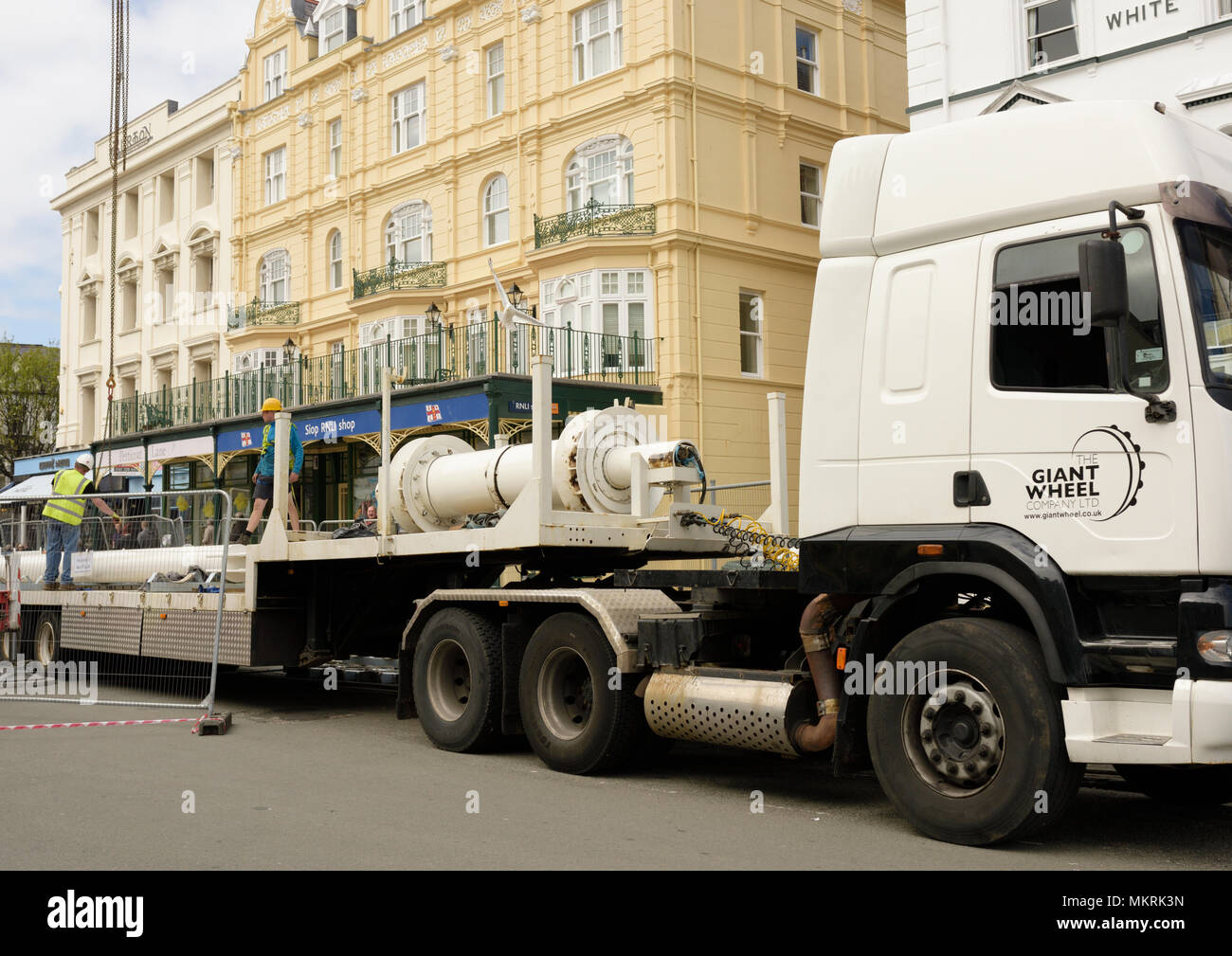 Heavy low loader lorry parked in front of victorian buildings in ...