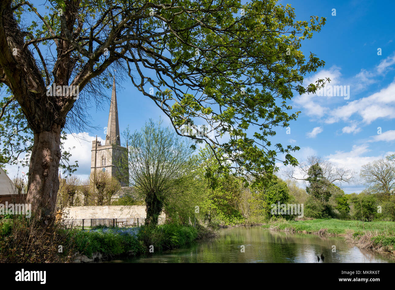 Burford Church and the river windrush in the spring sunshine. Burford ...