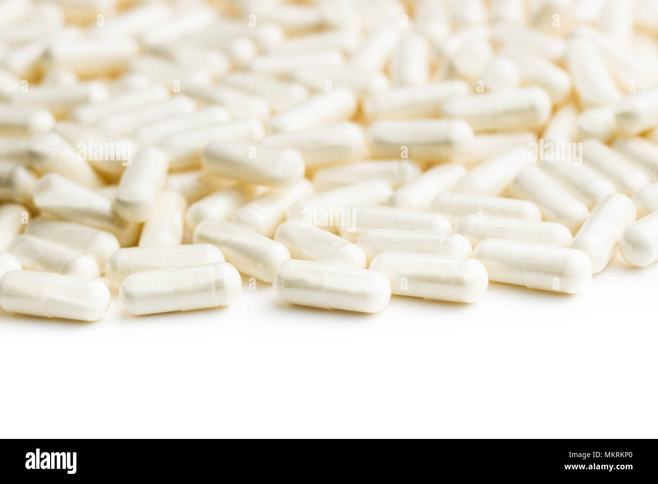 White medicine capsules isolated on white background Stock Photo - Alamy