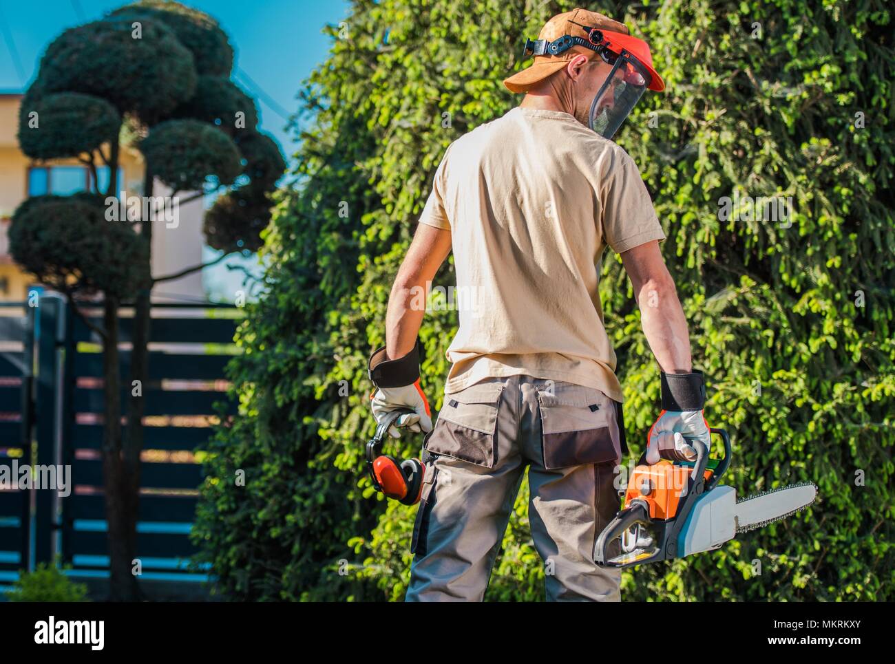 Men in the Garden. Caucasian Garden Worker with Power Tools Preparing ...