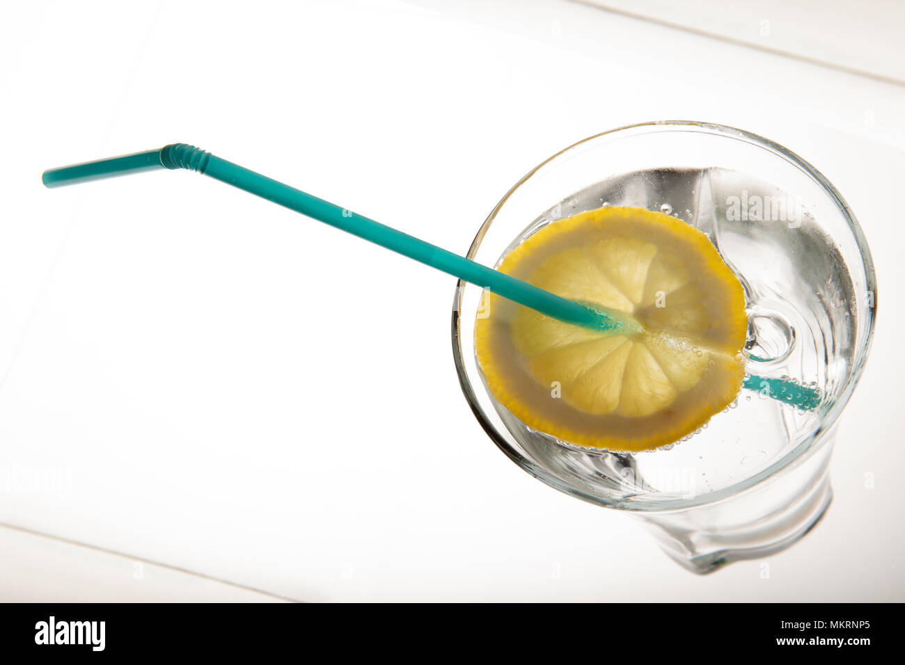 A glass of fresh drinking water and a lime. mineral water , lime and ...