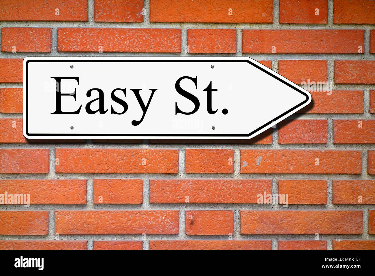 Easy street signpost on wall of bricks Stock Photo - Alamy