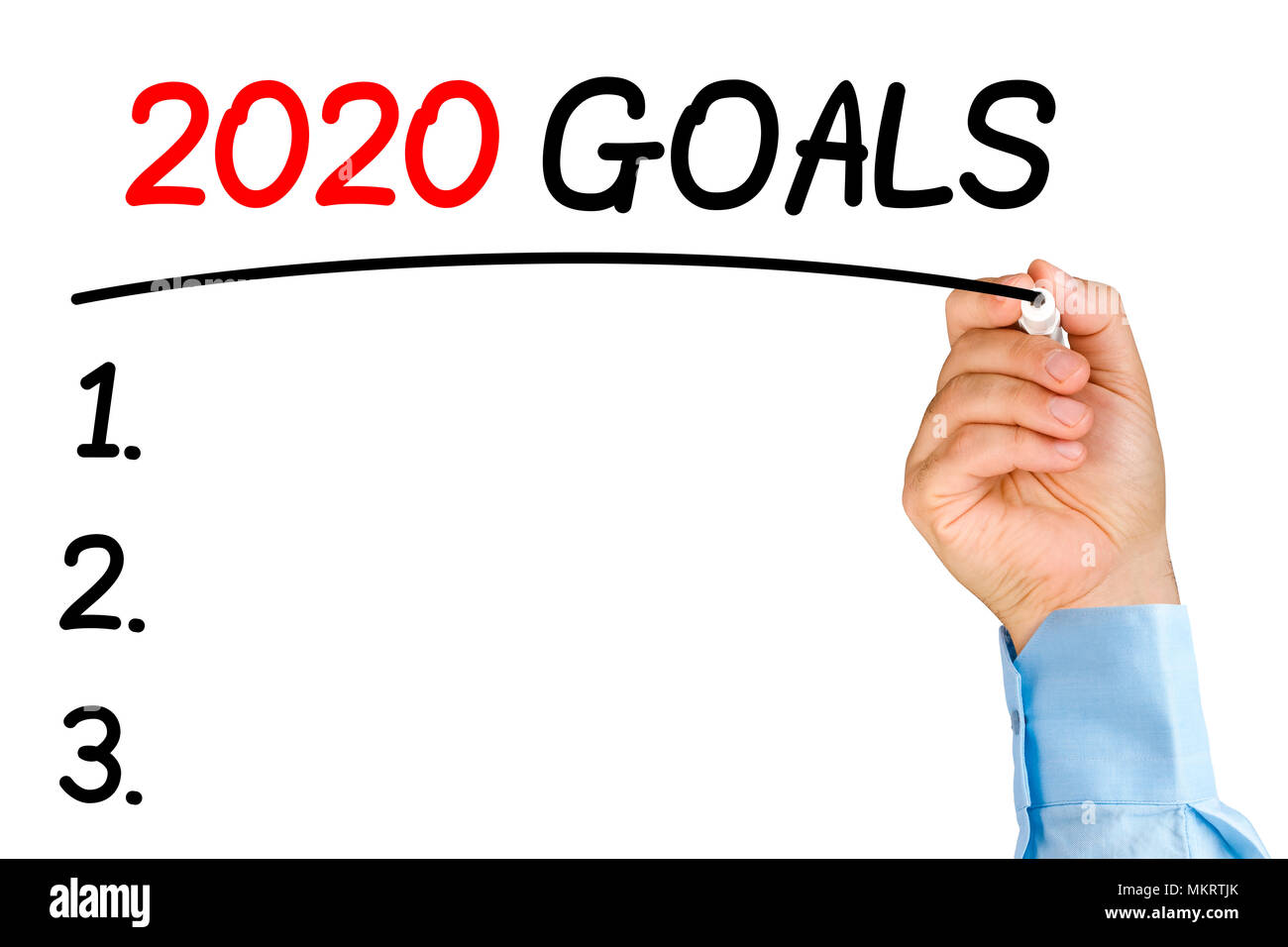 Businessman underlining 2020 goals text with black felt-tip or marker ...