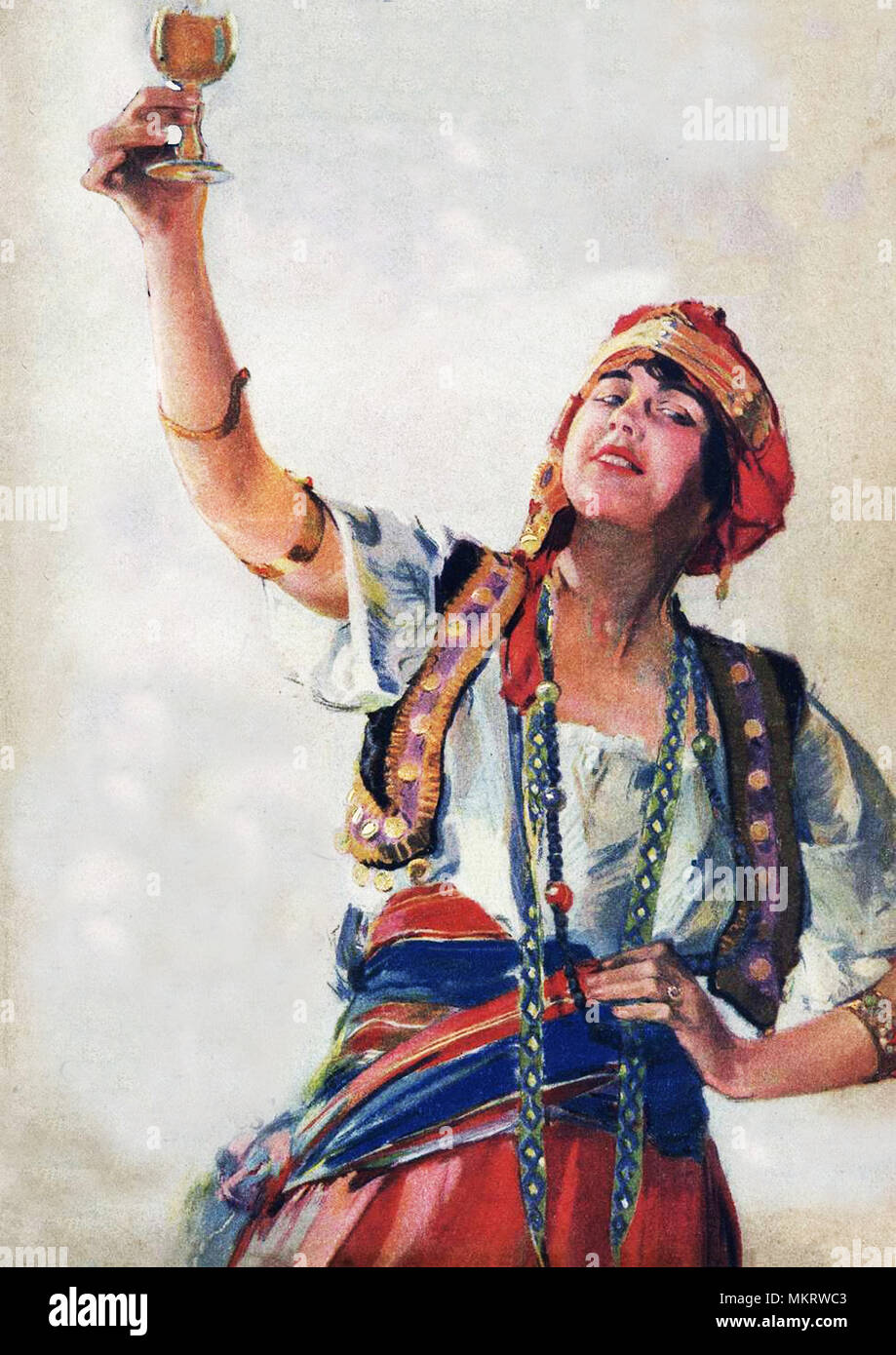 cheers! A gypsy girl holding up a chalice Stock Photo - Alamy
